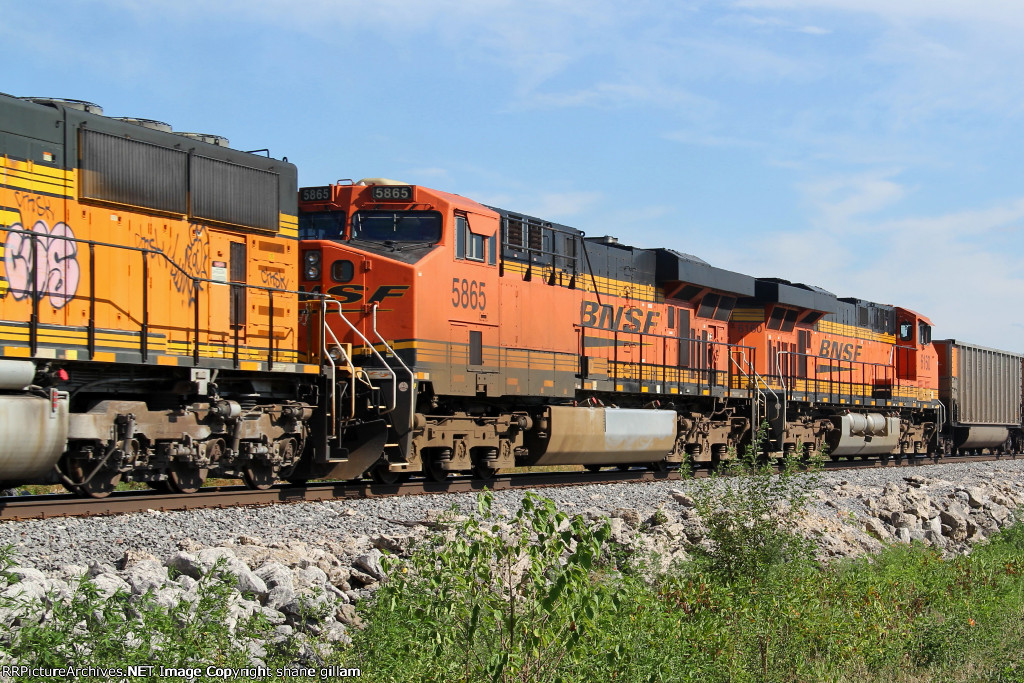 BNSF 5865 and 6150 help this empty coal out.